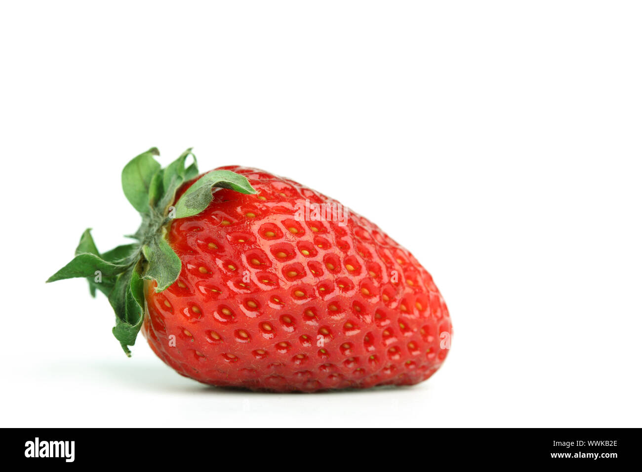 one strawberry on white background Stock Photo - Alamy