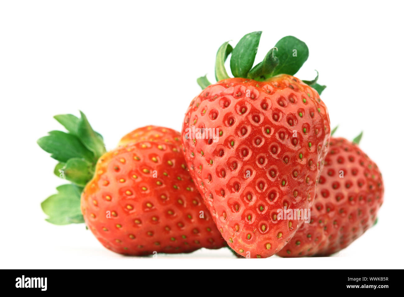 strawberry pile on white background Stock Photo - Alamy