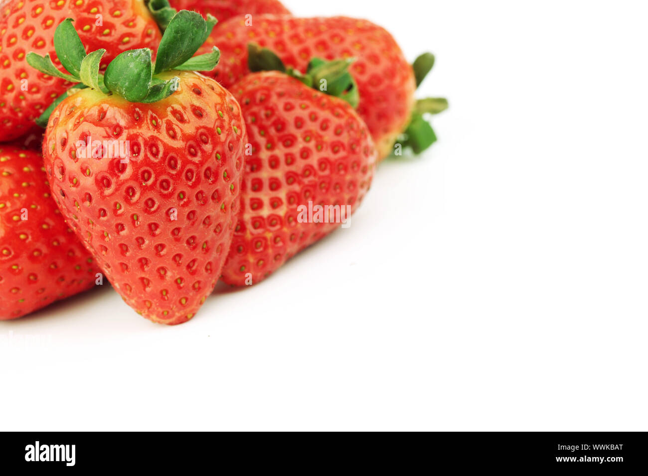 strawberry pile on white background Stock Photo - Alamy