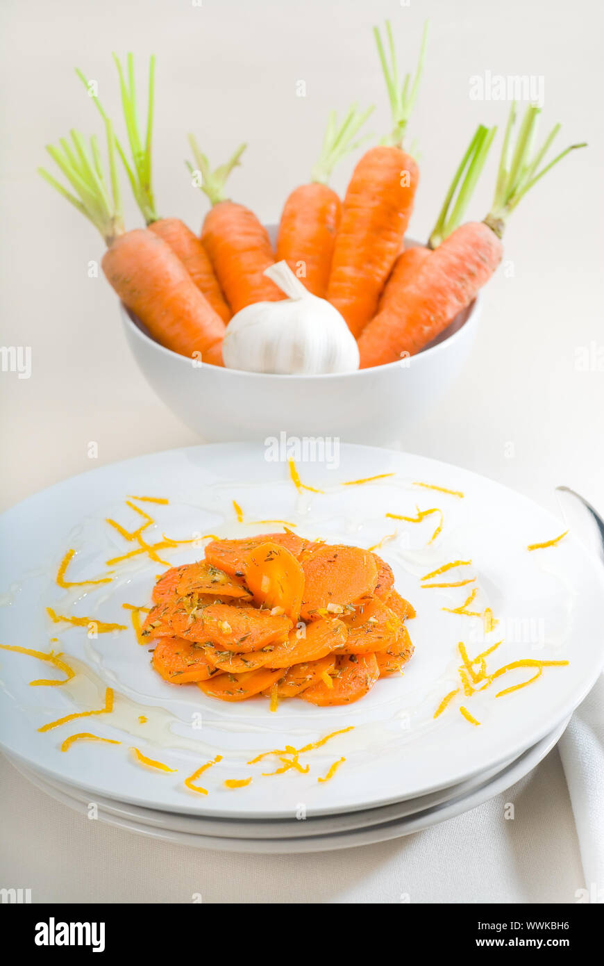 fresh and healthy Honey glazed carrots on a plate with tyme on top ...