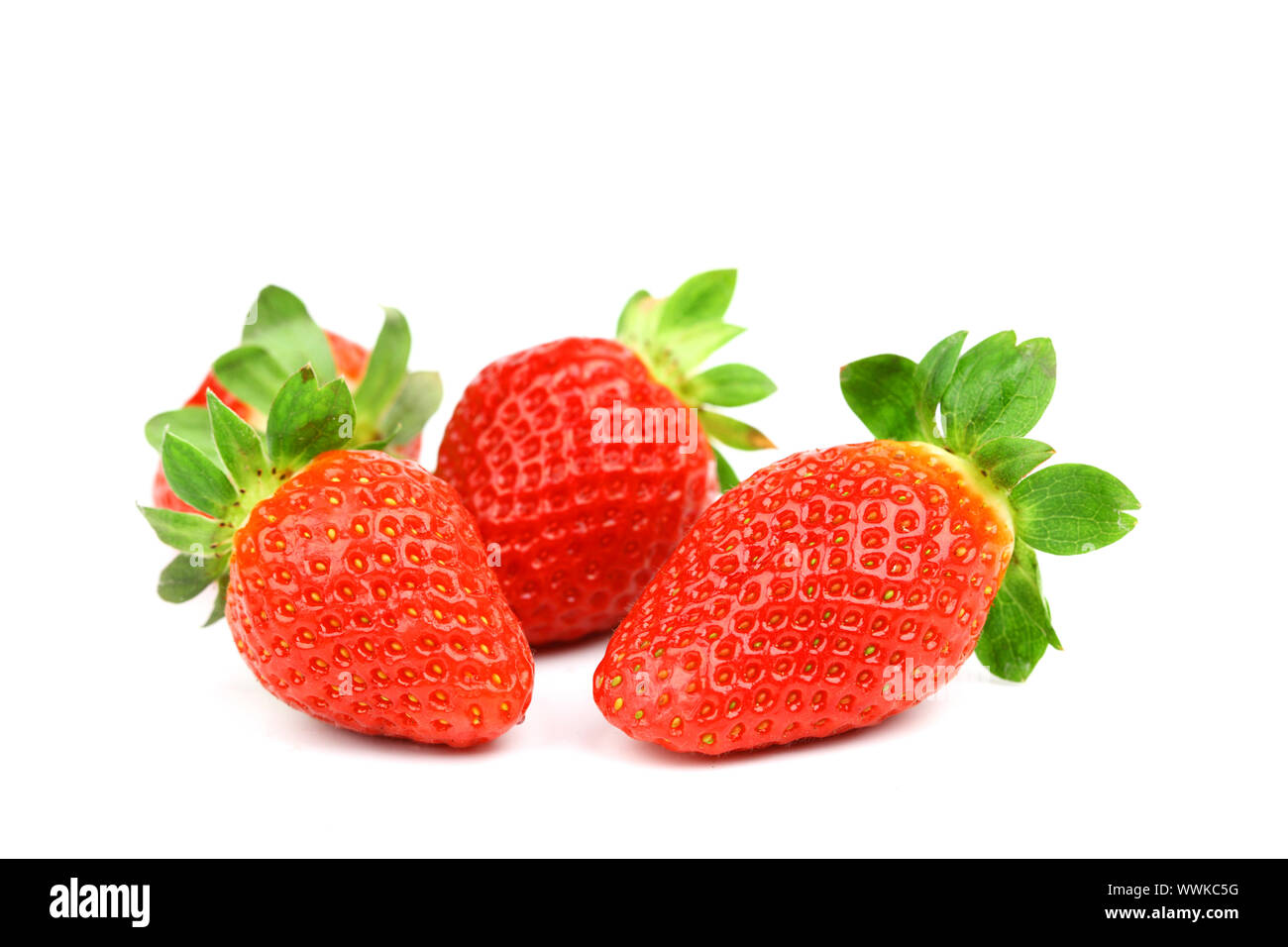 strawberry pile isolated on white background Stock Photo - Alamy