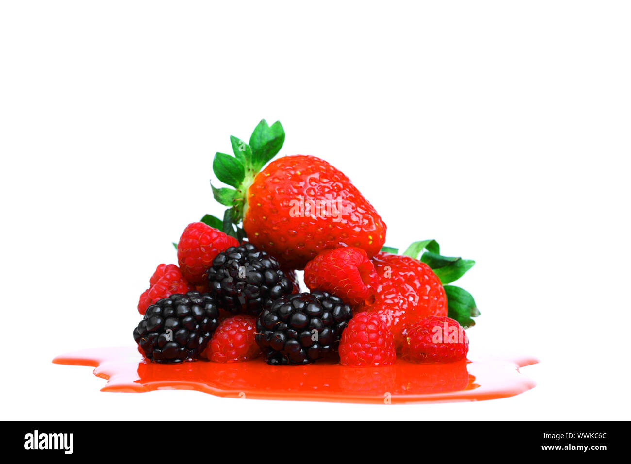 big berry pile in syrup isolated on white Stock Photo - Alamy