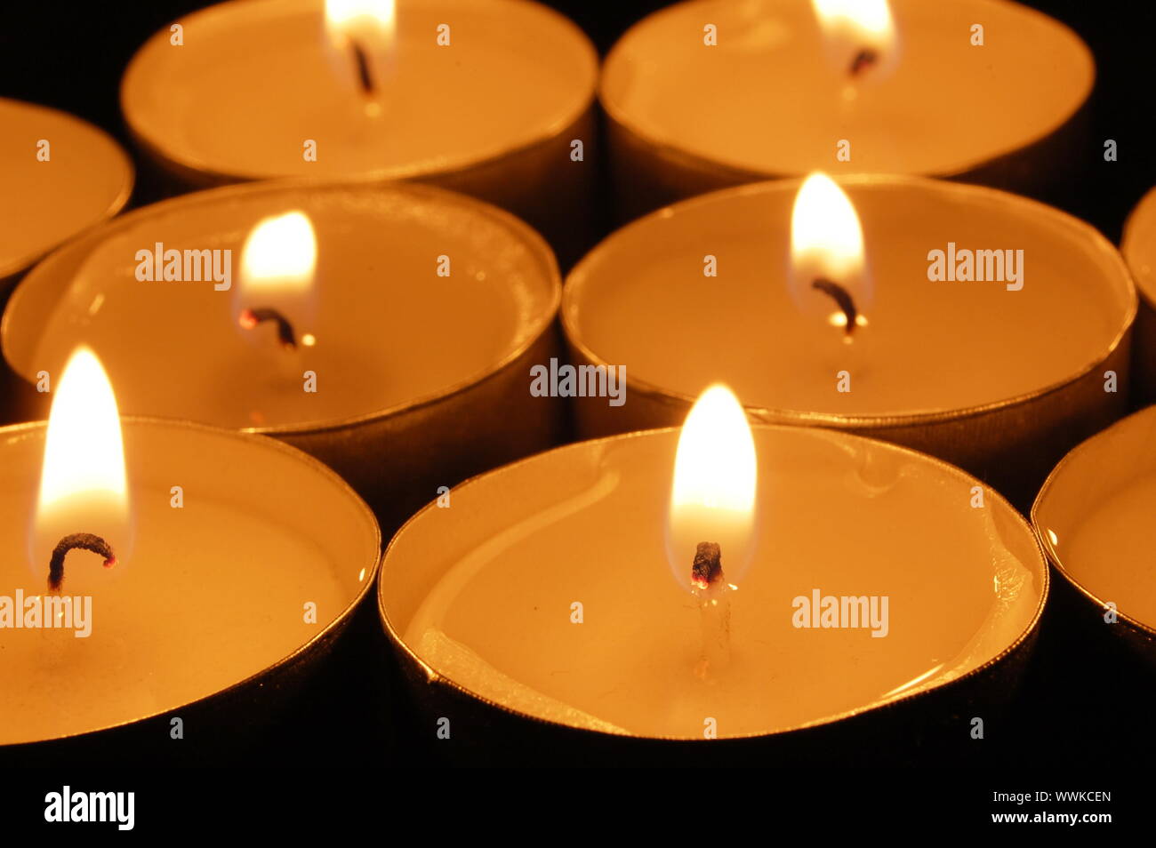romantic hot candle light on black background Stock Photo - Alamy