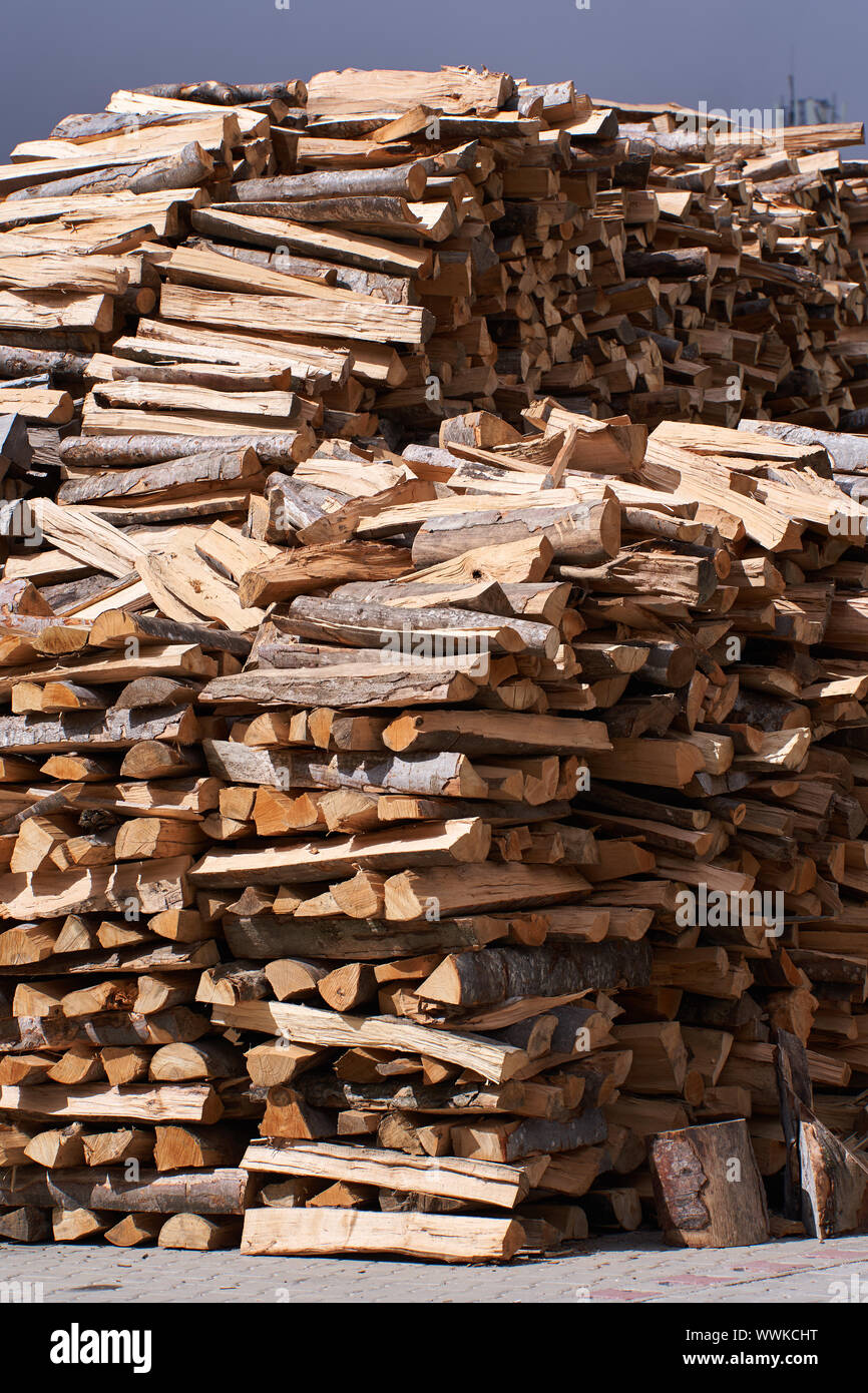 Big stacks of fire wood for winter time Stock Photo - Alamy