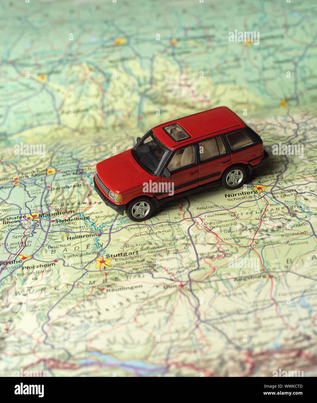 Toy Car on a road map close up Stock Photo - Alamy