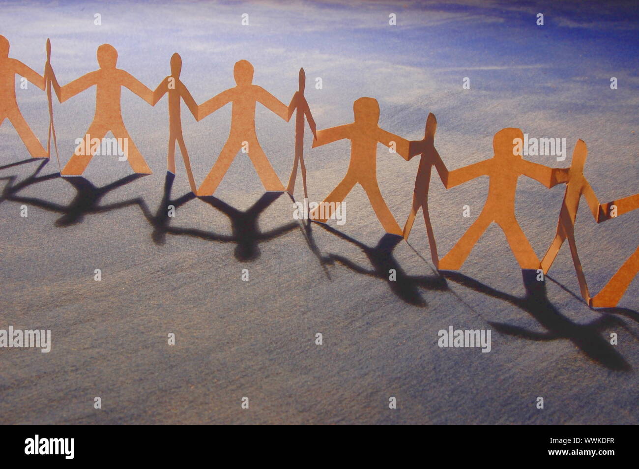 paper people doing teamwork in their business Stock Photo - Alamy