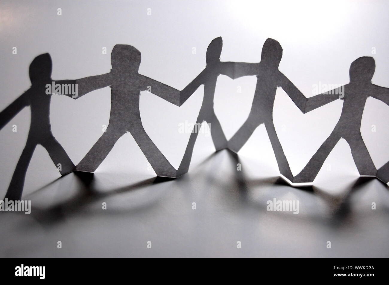 paper people doing teamwork in their business Stock Photo - Alamy