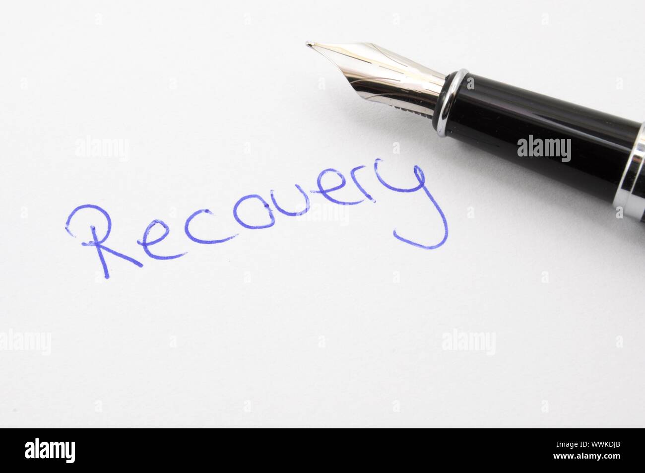 recovery concept with word written on paper and pen Stock Photo - Alamy