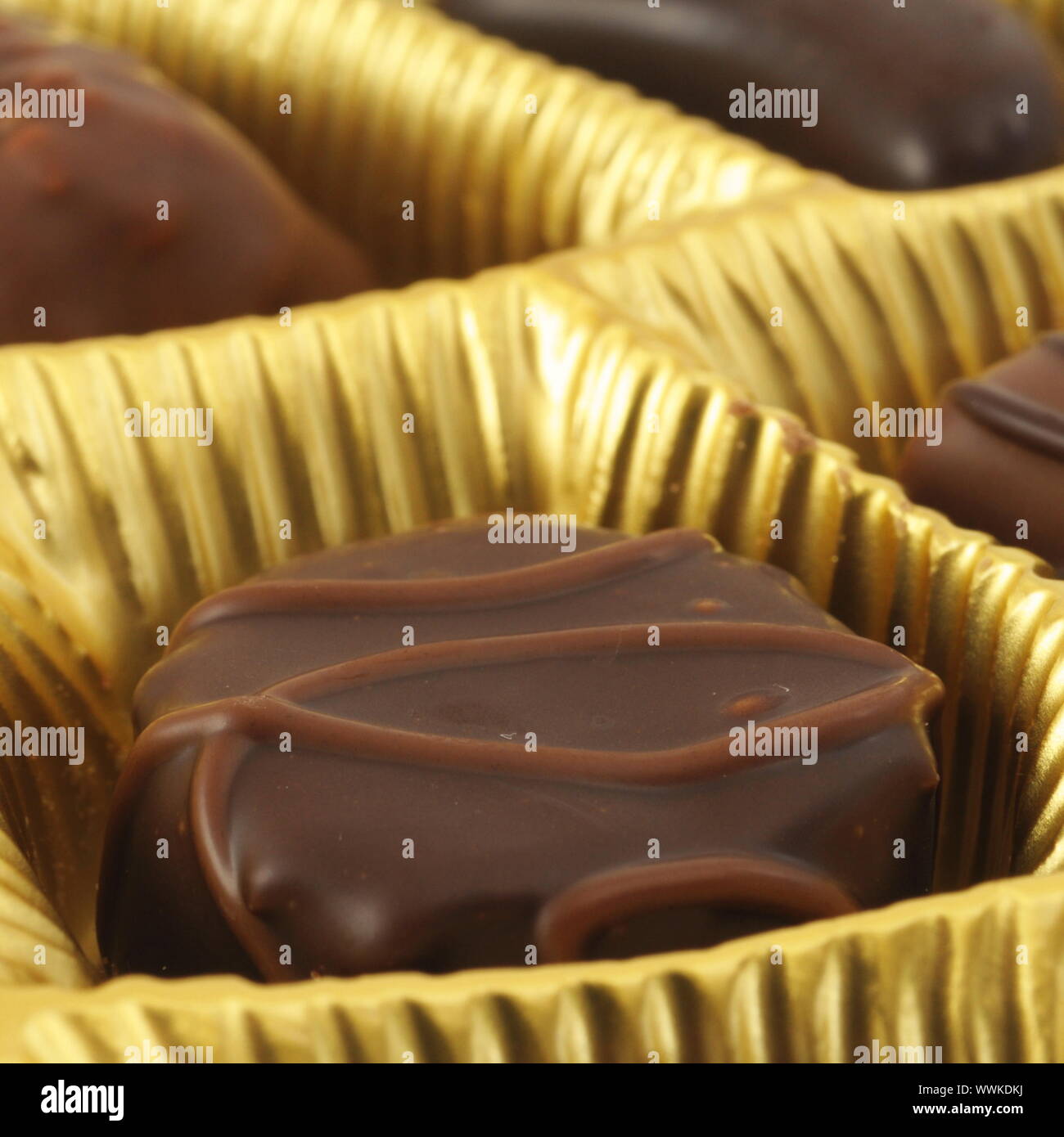 praline candy in an golden exclusive box Stock Photo - Alamy