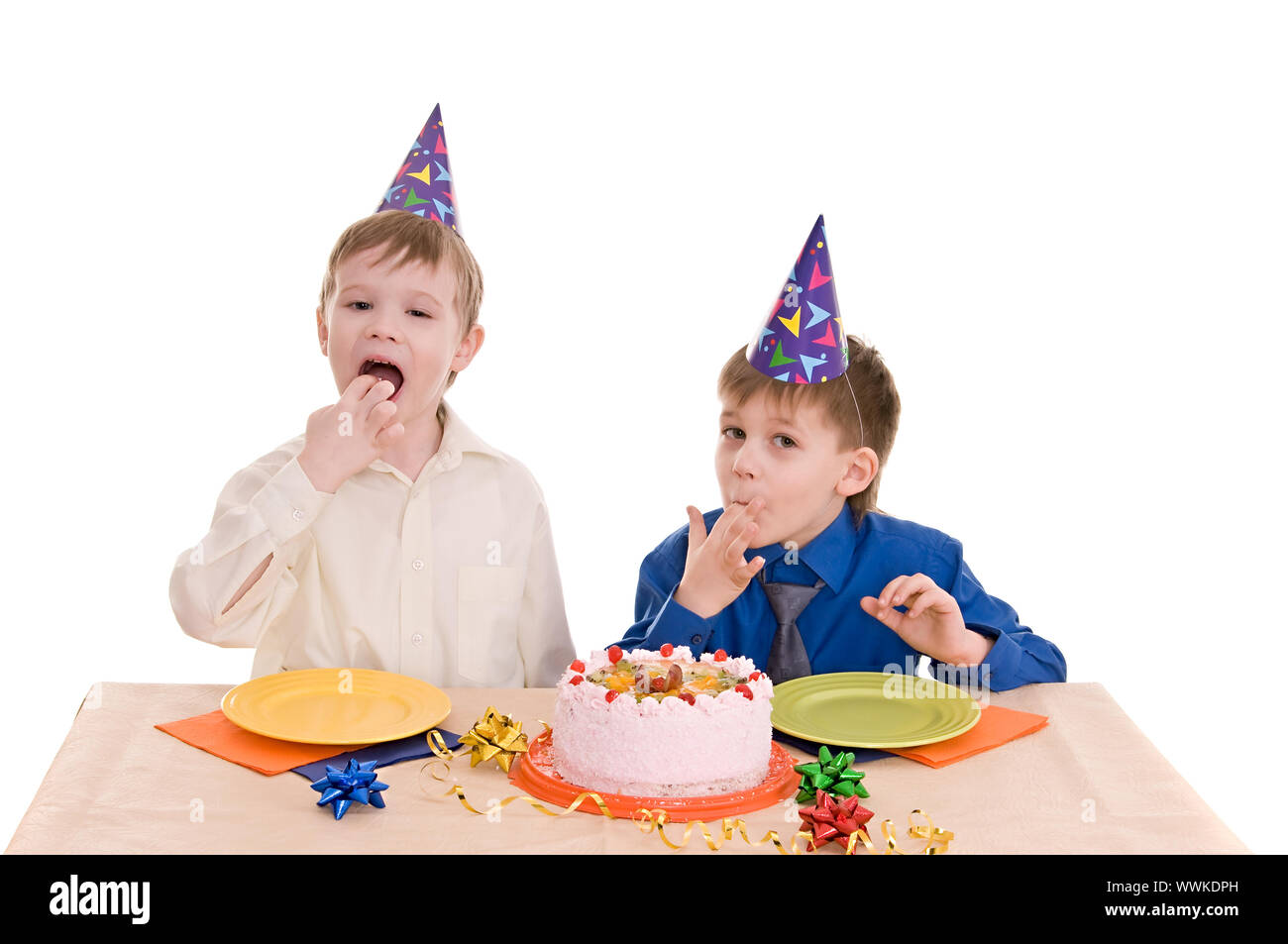 two boys eating a cake his hands isolated on white background Stock ...