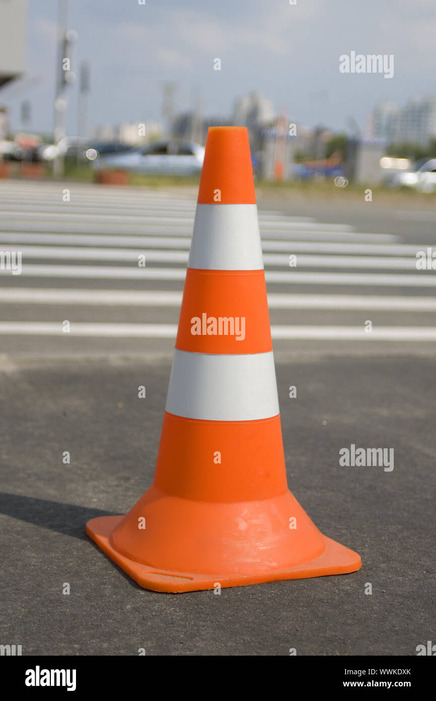 Close up of one traffic cone on a road with path Stock Photo - Alamy
