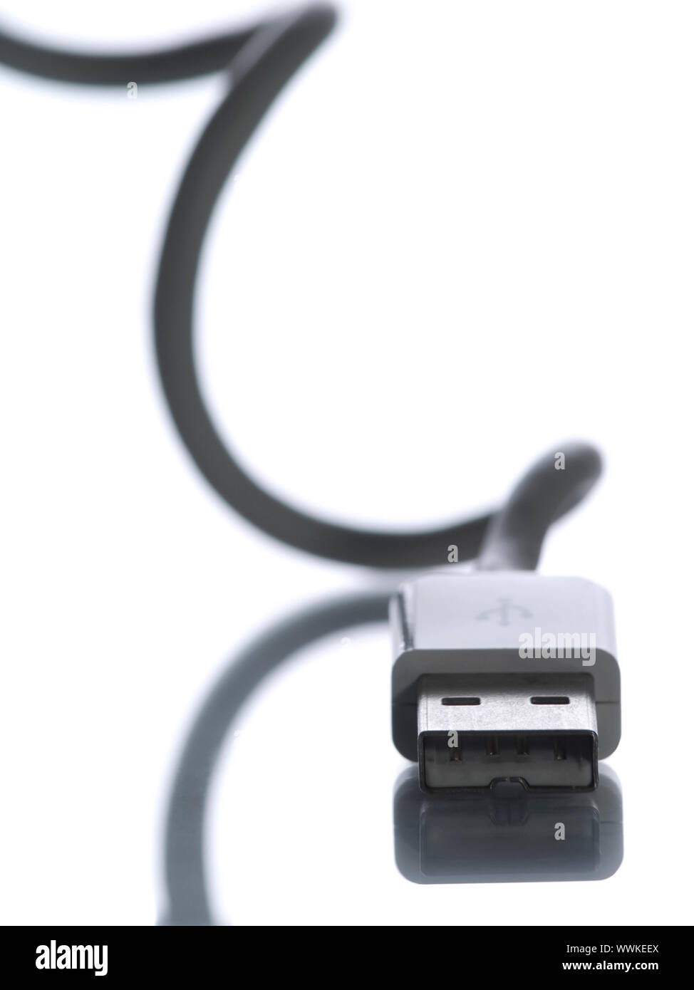 An USB connection facing camera with its cable curling and reflecting ...