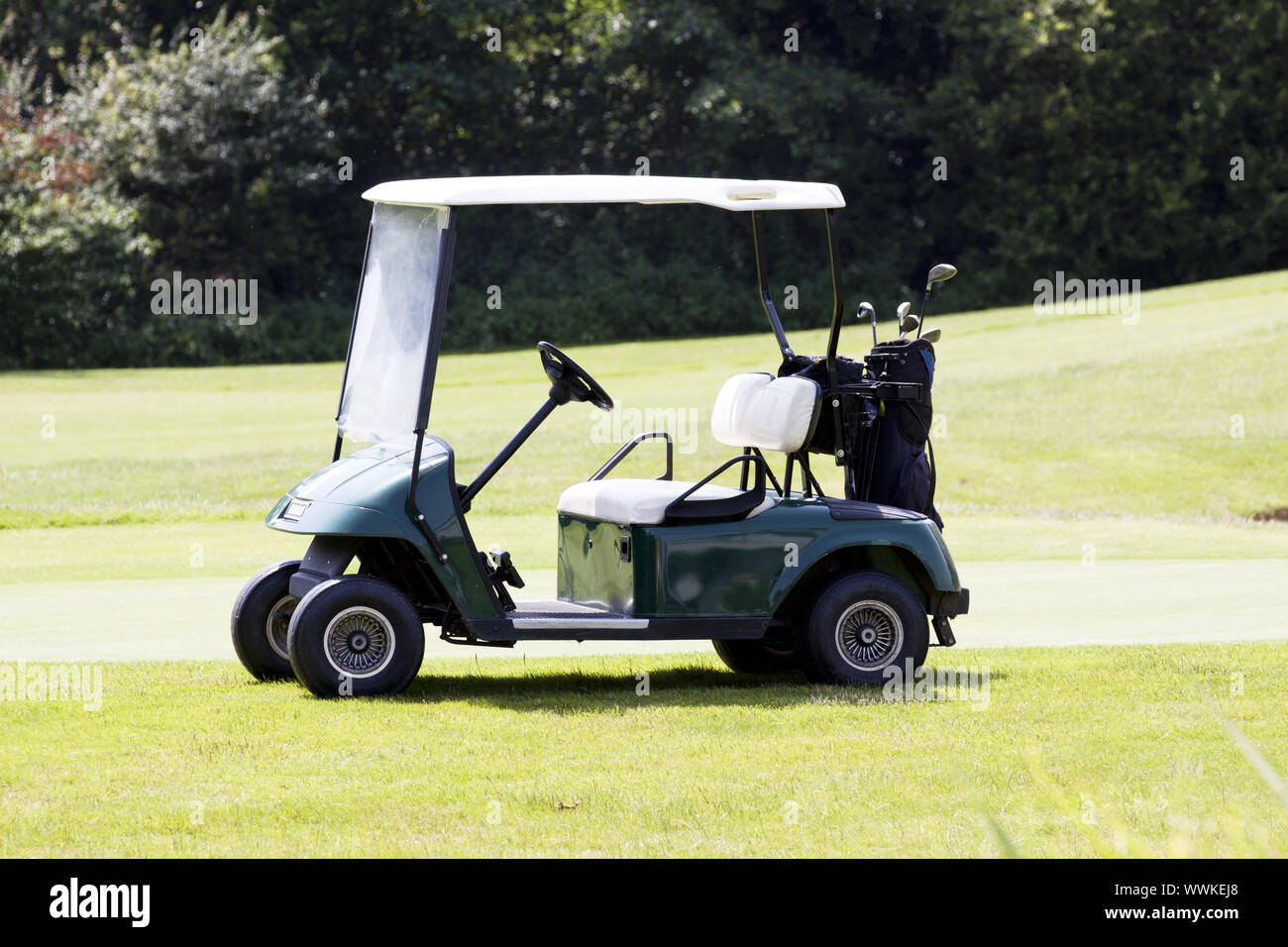 Golf Car Caddy on a golf course summer Stock Photo - Alamy
