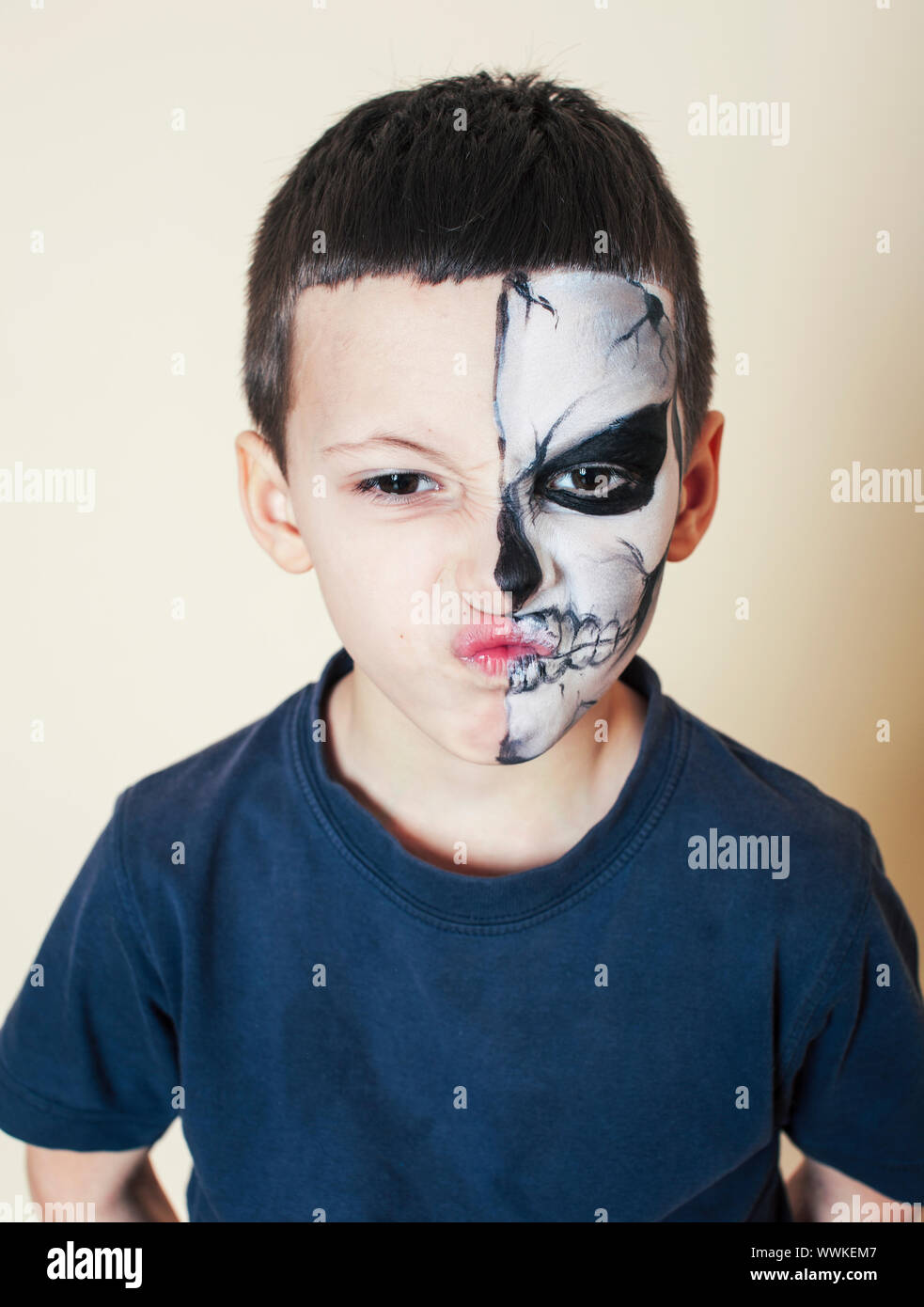 little cute boy with face paint like skeleton to celebrate halloween ...