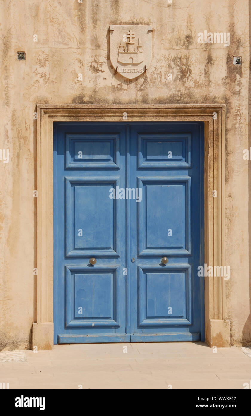 beautiful blue door of a church in corsica Stock Photo - Alamy