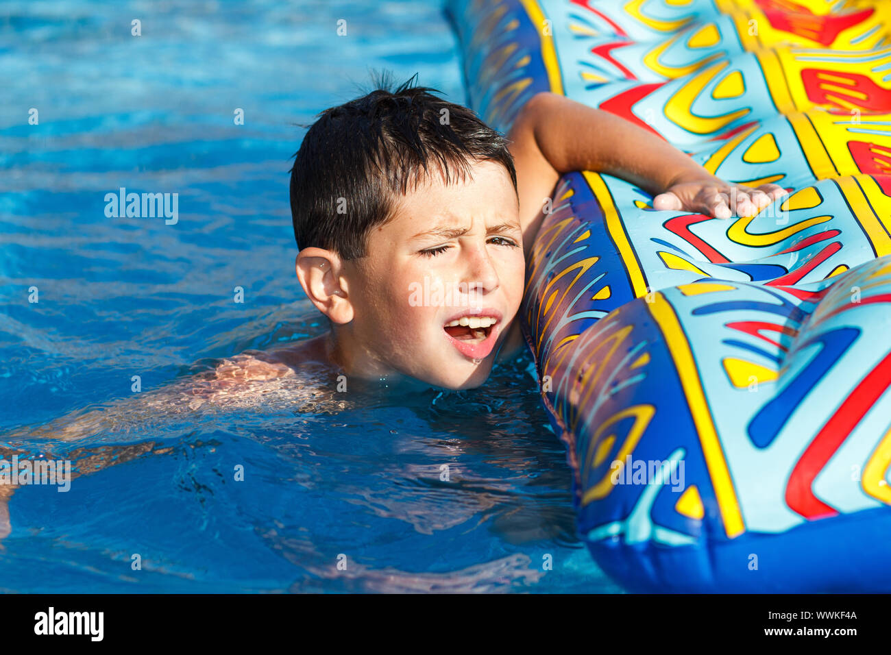 Boy in swimming pool Stock Photo - Alamy