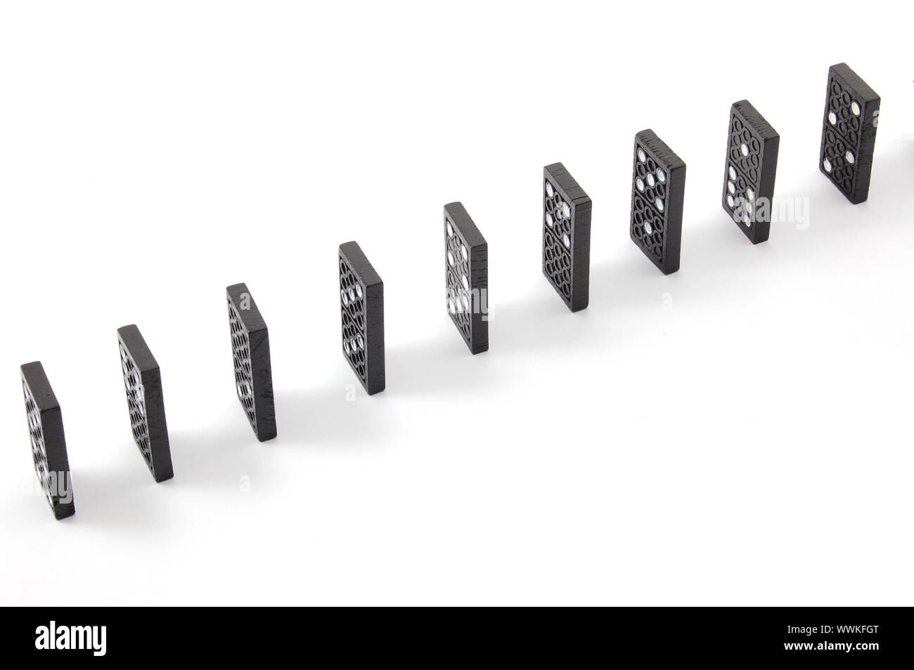 chain of dominoes isolated on a white background Stock Photo - Alamy
