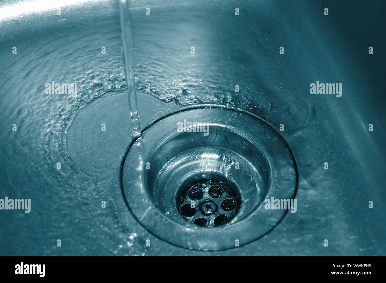 water flow into the drain in the kitchen Stock Photo - Alamy