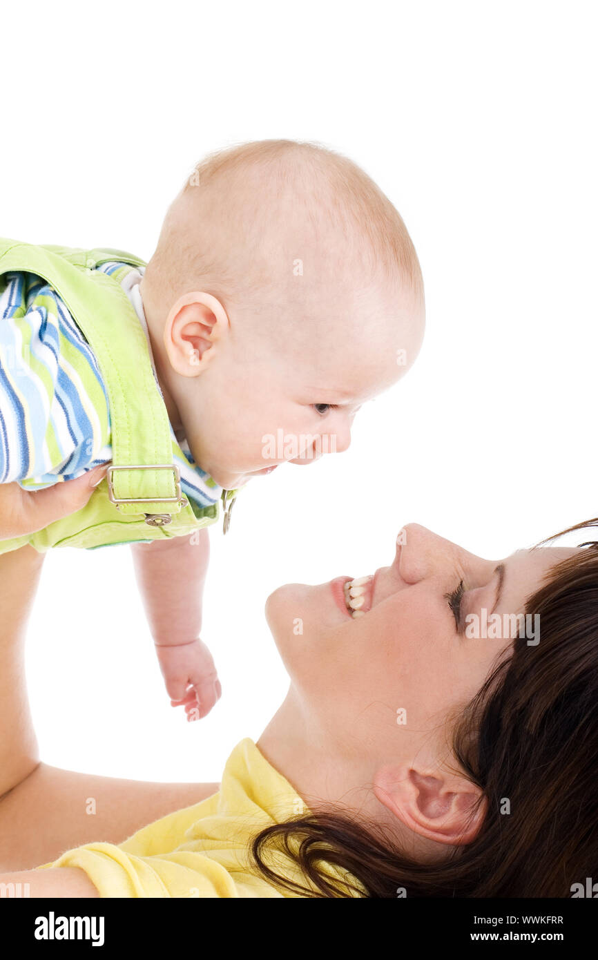 Young beautiful mother catching her innocent baby Stock Photo - Alamy