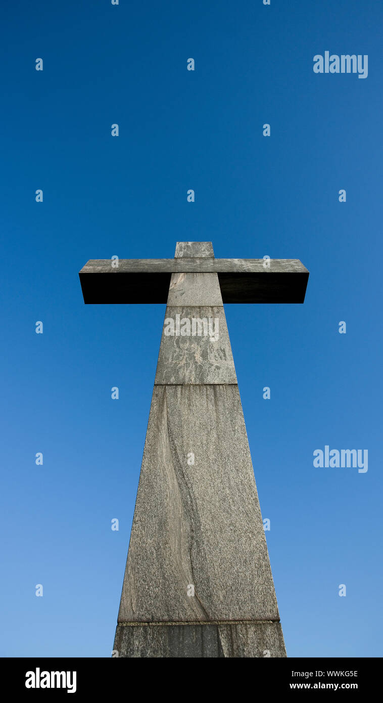 Cross symbol in front of blue sky Stock Photo - Alamy