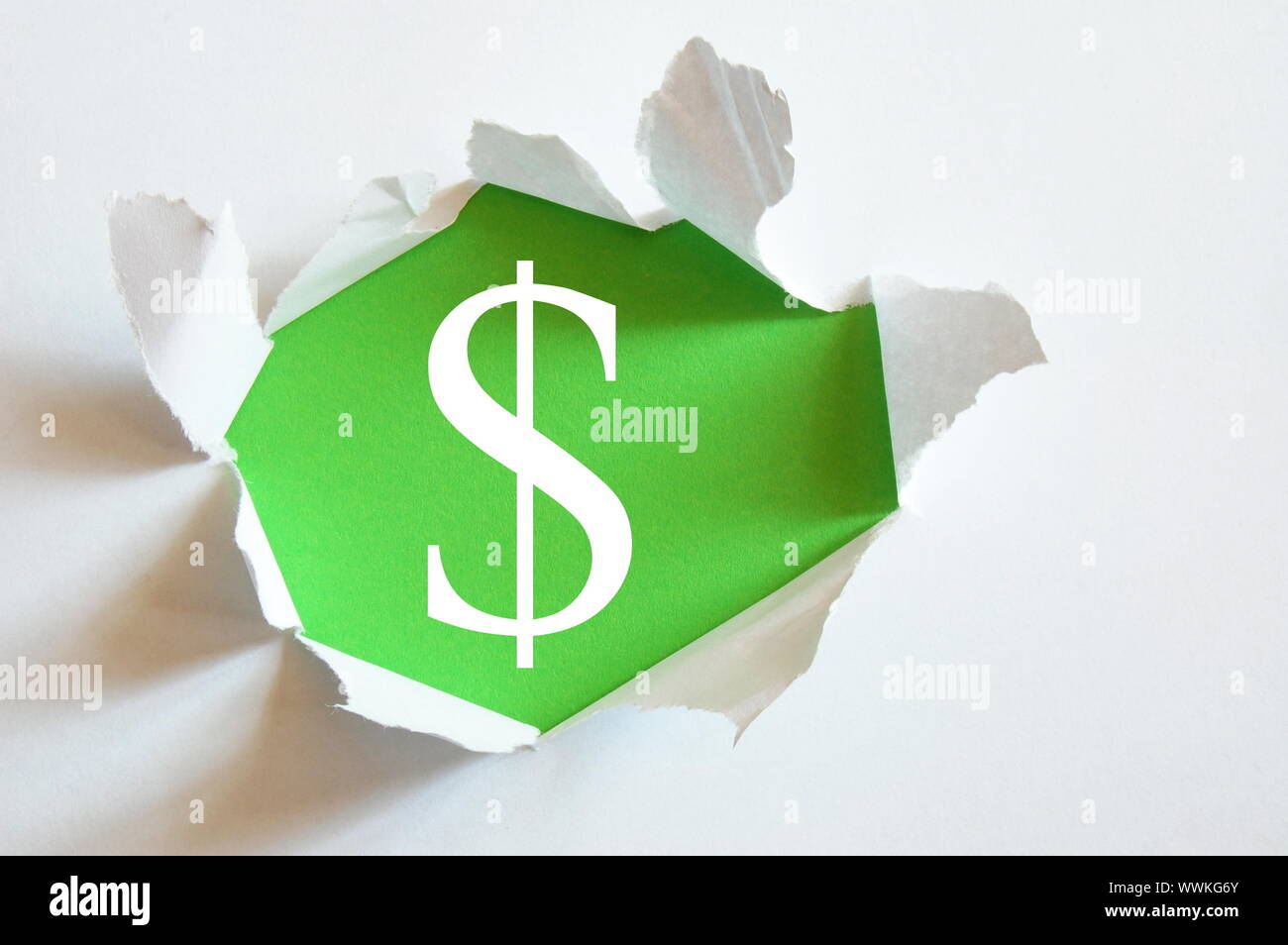 money concept with hole in blank paper Stock Photo - Alamy