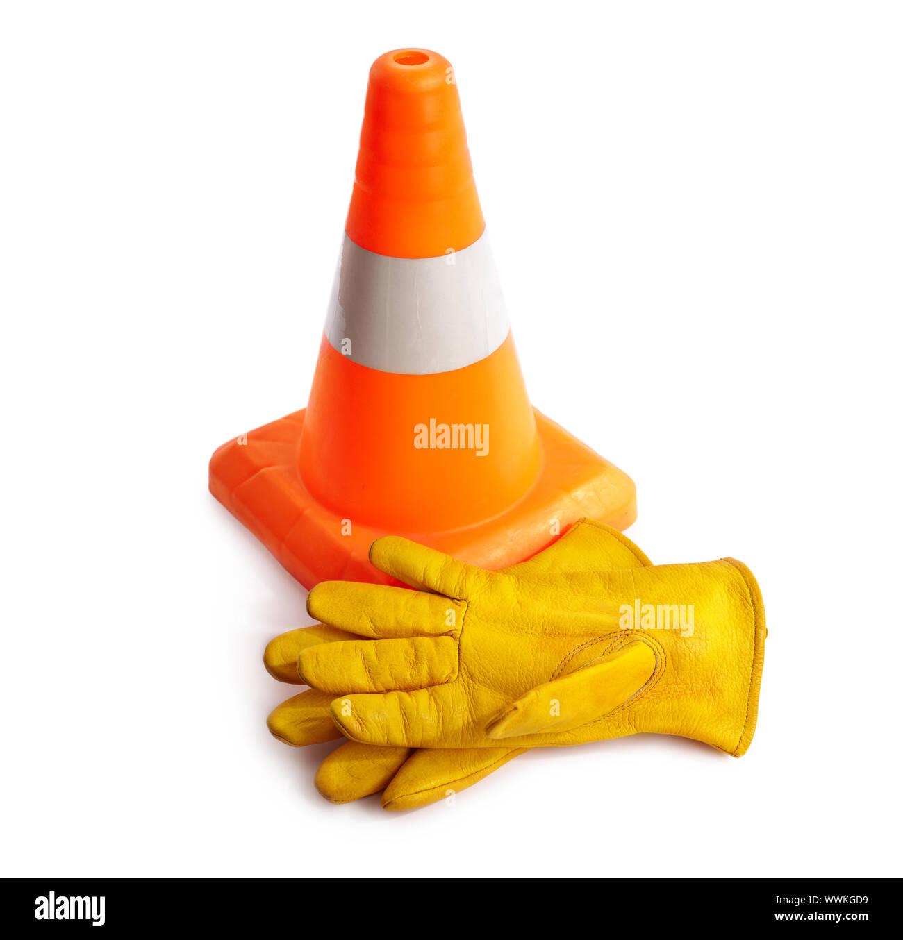 Traffic cone and working gloves isolated on white background, selective ...