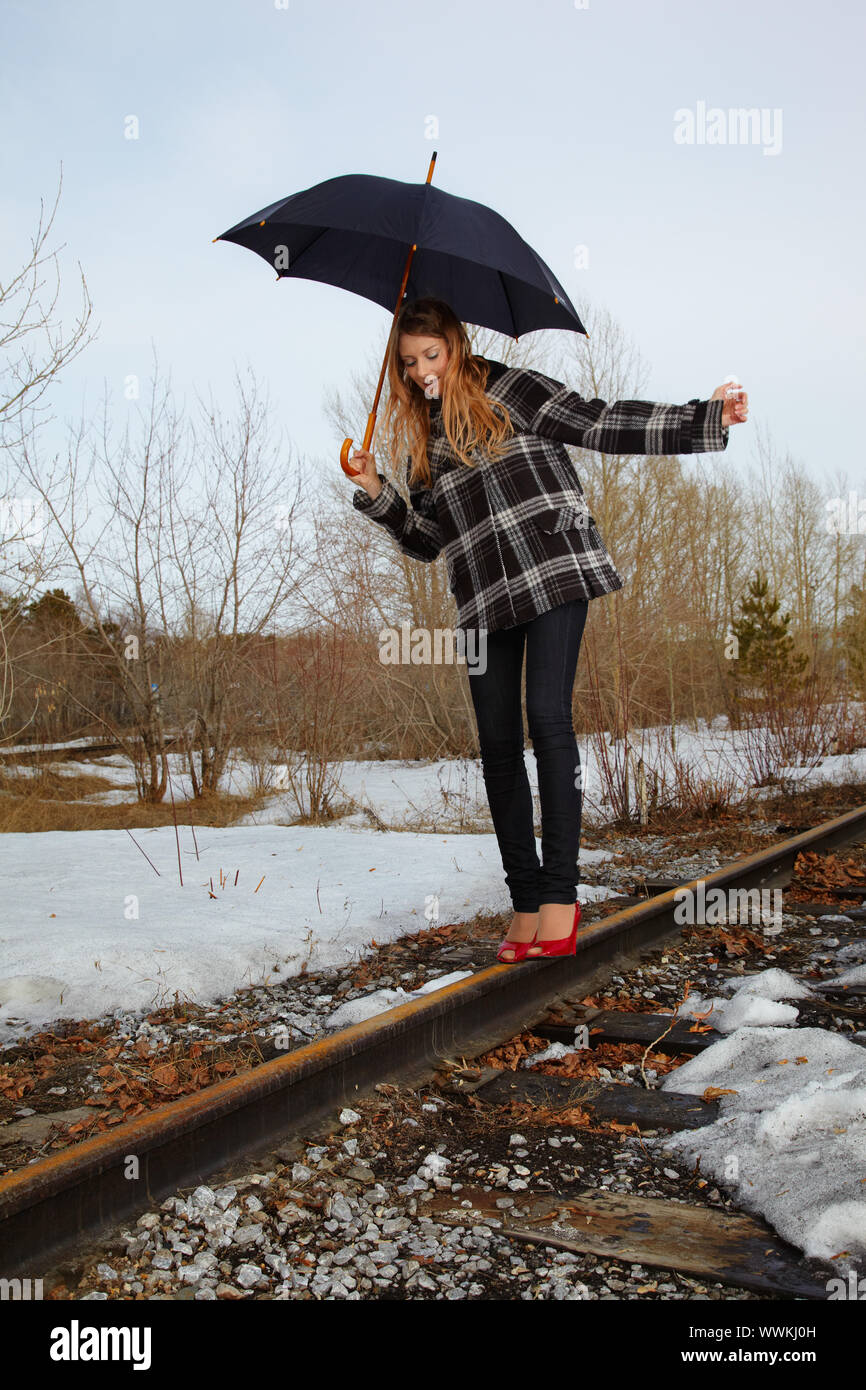 Girl walking on rail track hi-res stock photography and images - Alamy