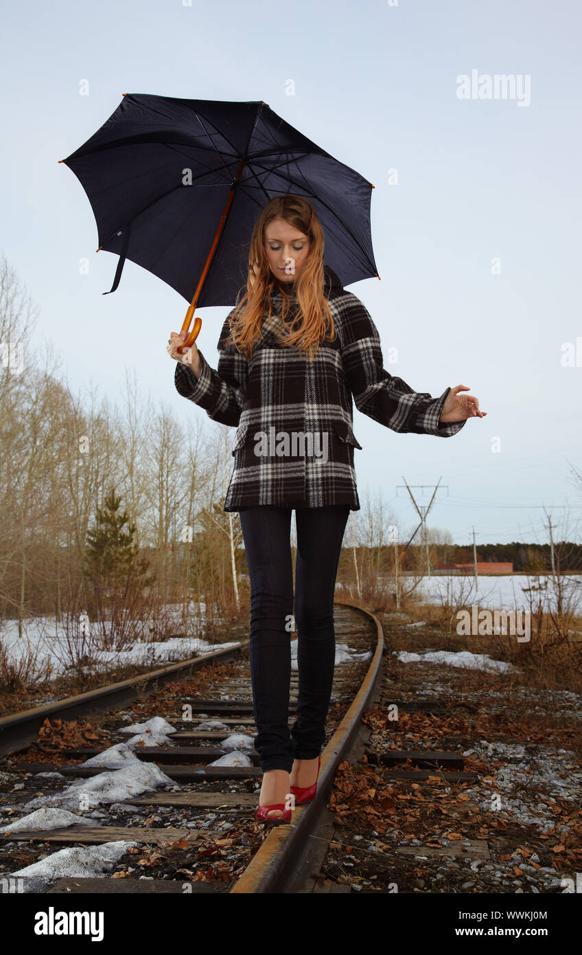Girl walking on rail track hi-res stock photography and images - Alamy