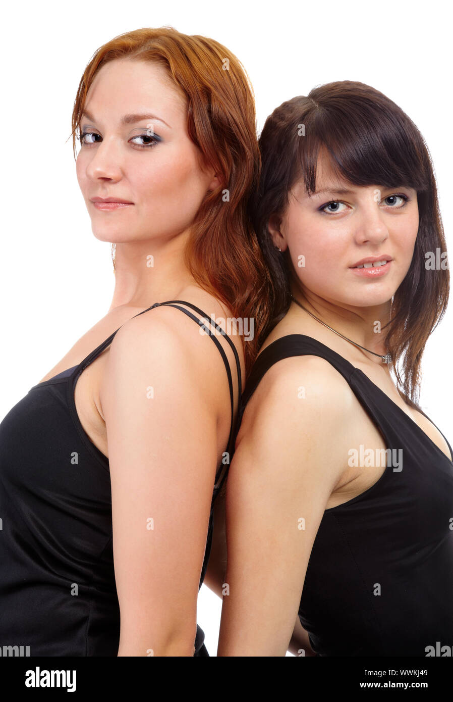 portrait of two beautiful models posing in black dresses Stock Photo ...