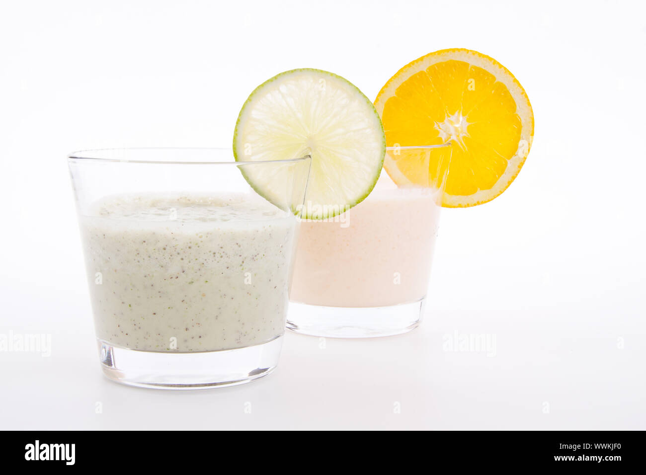 Fresh tasty yoghurt isolated with oranges and limes Stock Photo - Alamy