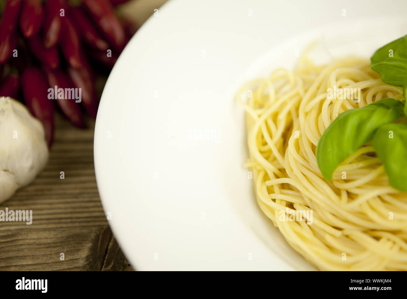 Fresh pasta with garlic and basil on one table Stock Photo - Alamy