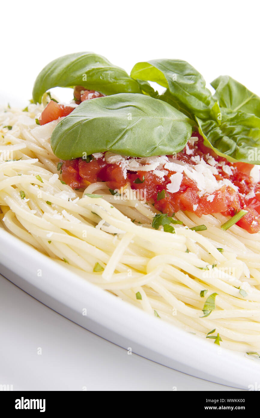 fresh tasty spaghetti with tomato sauce basil and Parmesan cheese ...