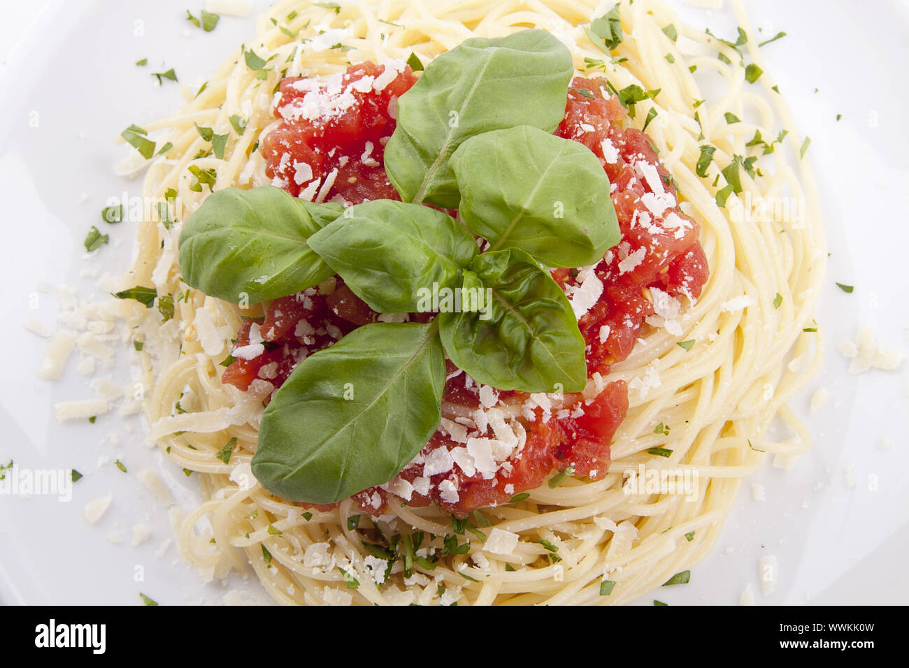 fresh tasty spaghetti with tomato sauce basil and Parmesan cheese ...