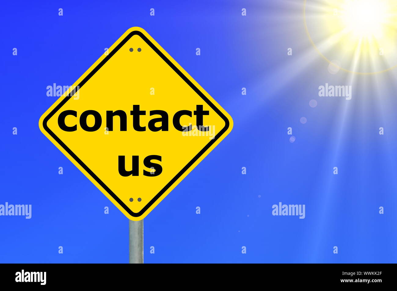contact us concept with a traffic marker in yellow Stock Photo - Alamy