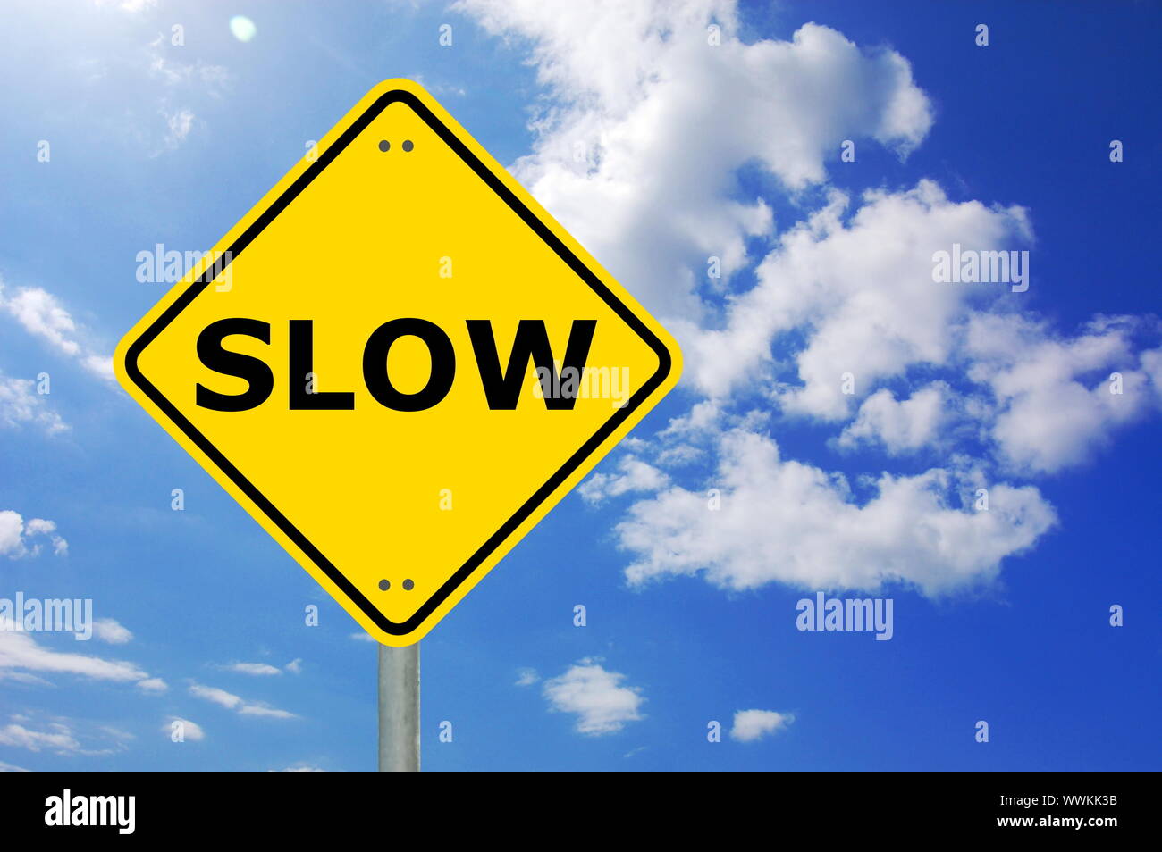 drive slow sign in yellow with copyspace Stock Photo - Alamy