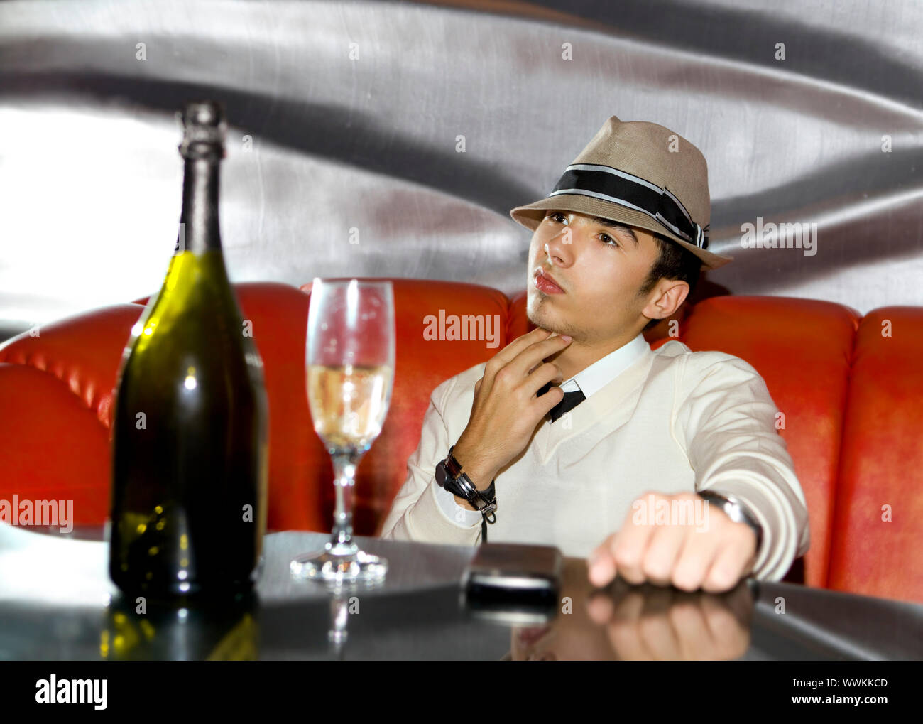 Attractive young gangster drinking in cocktail party at cabaret Stock ...