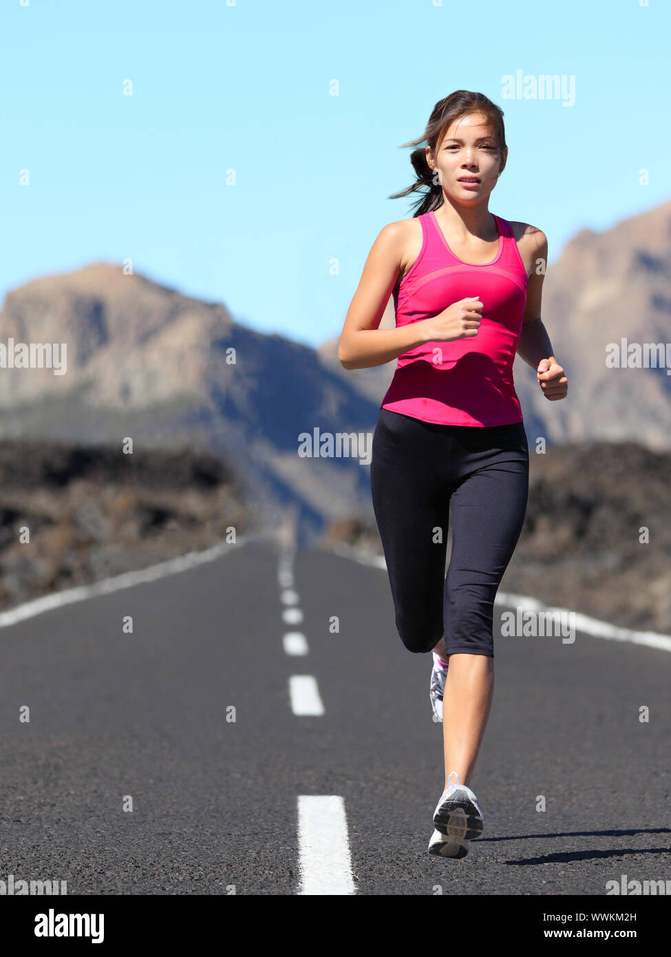 Jogging woman running. Female runner during outdoor workout in ...