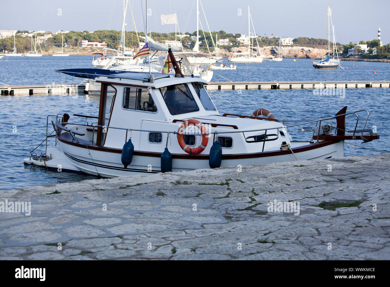 fishing boat in the harbour at the quay in the water Stock Photo - Alamy