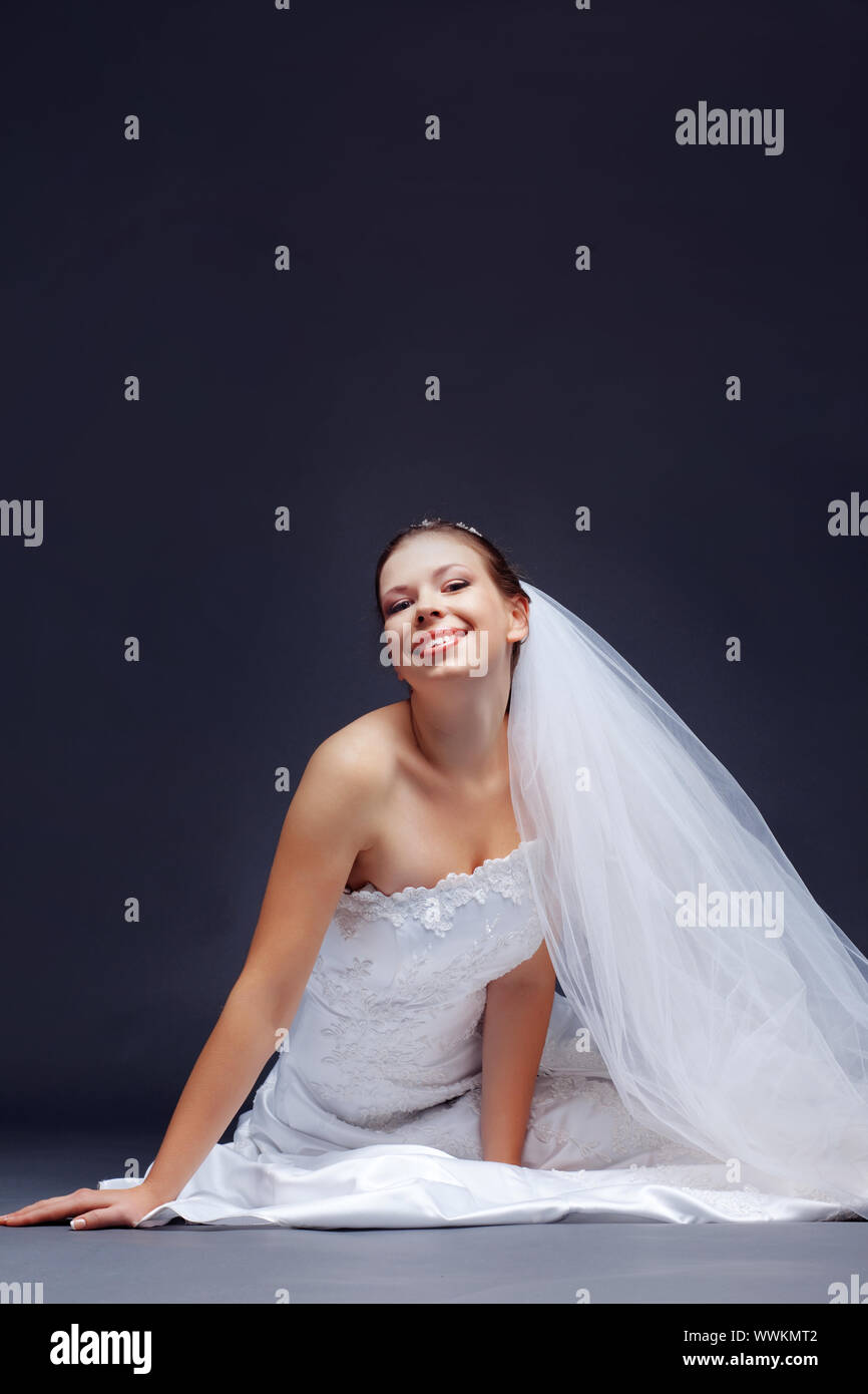 Studio portrait of cheerful bride Stock Photo - Alamy