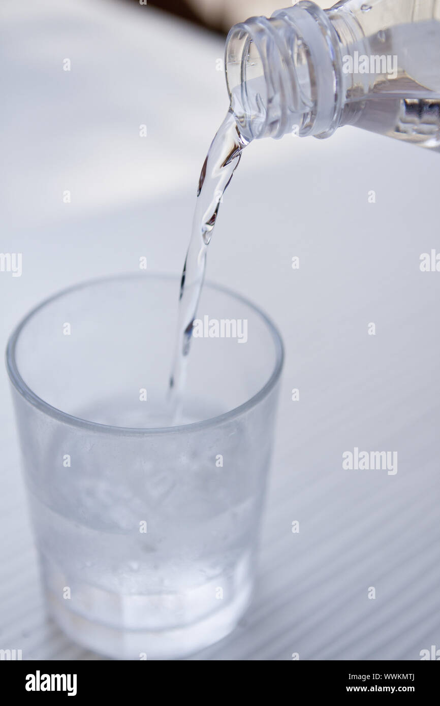 fresh cold clear water in a bottle and a glass Stock Photo - Alamy