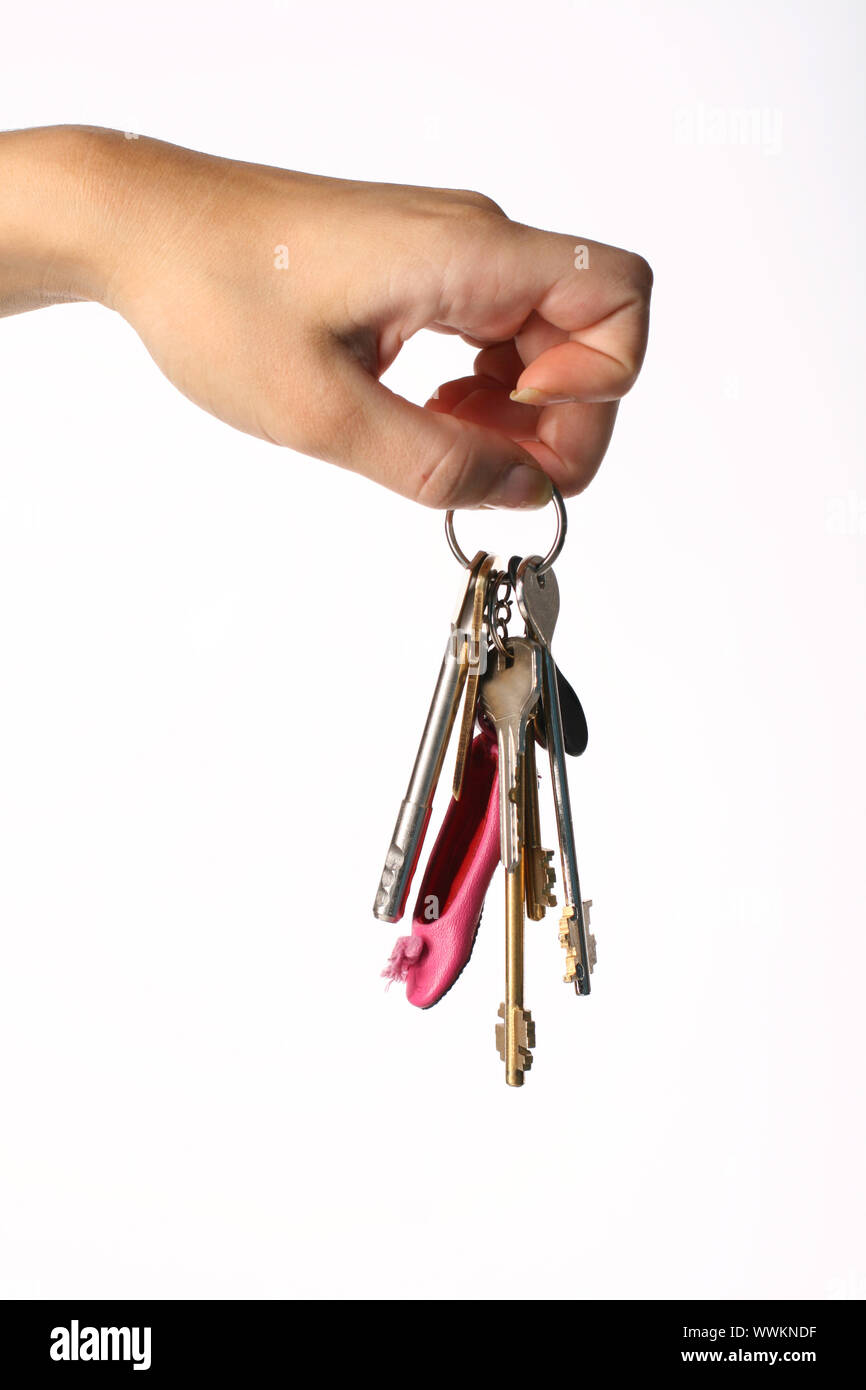 girl hand take key in fingers Stock Photo - Alamy