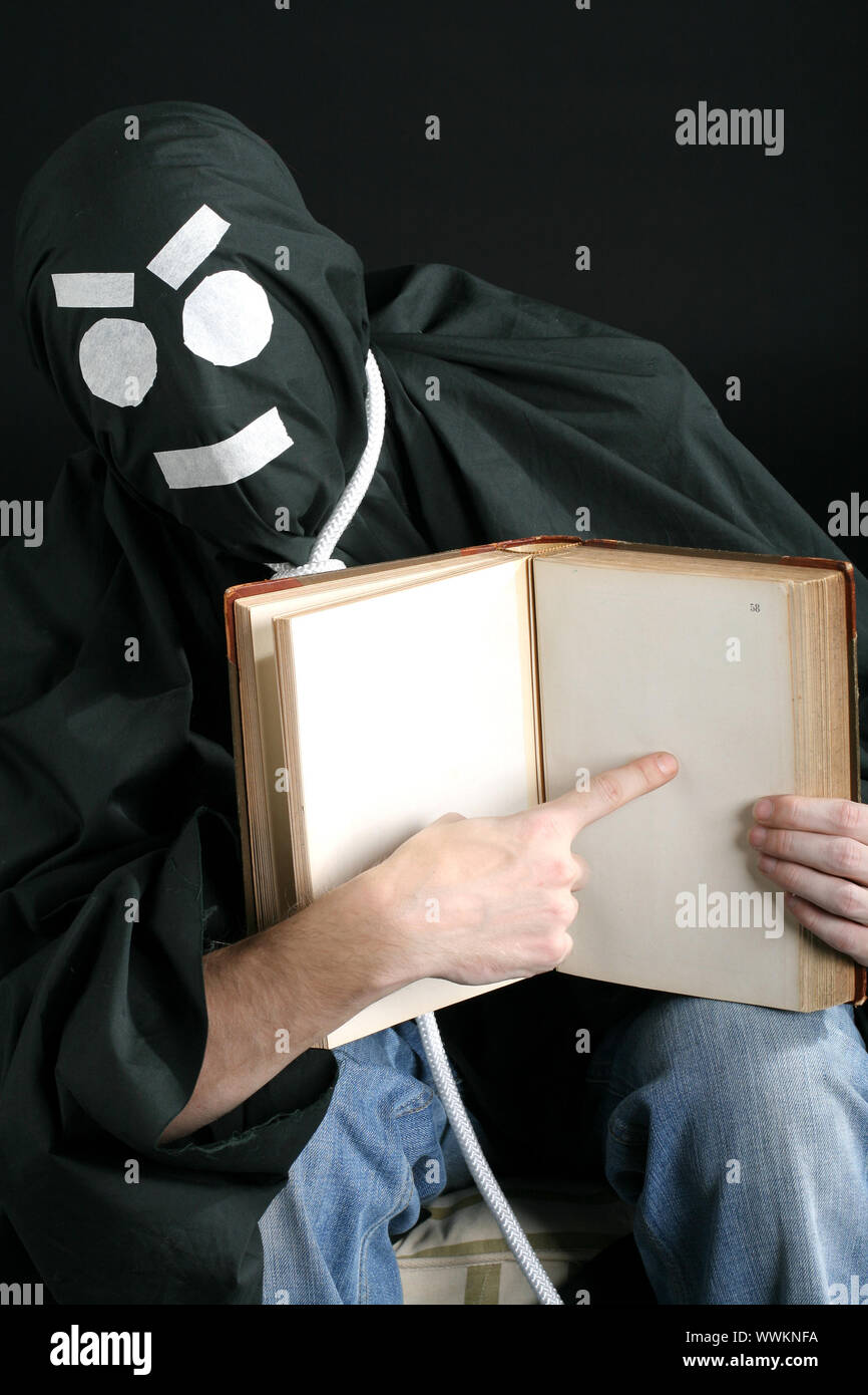 scary black mime with book Stock Photo - Alamy