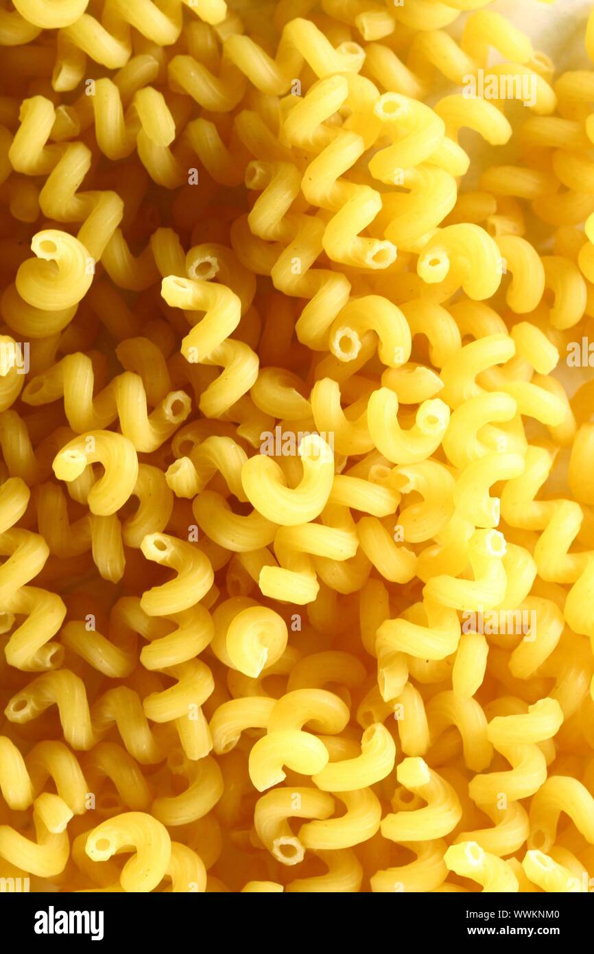 macro Macaroni yellow food background Stock Photo - Alamy