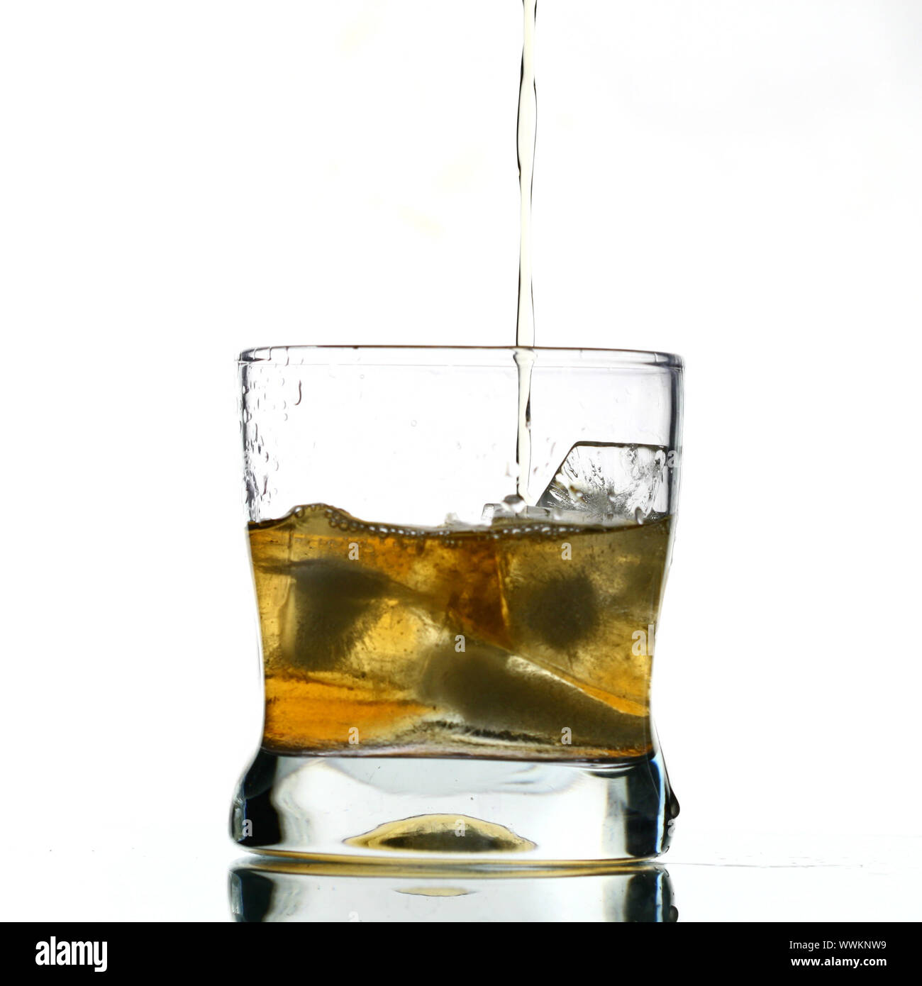 whisky splash alcohol drops isolated on white Stock Photo - Alamy