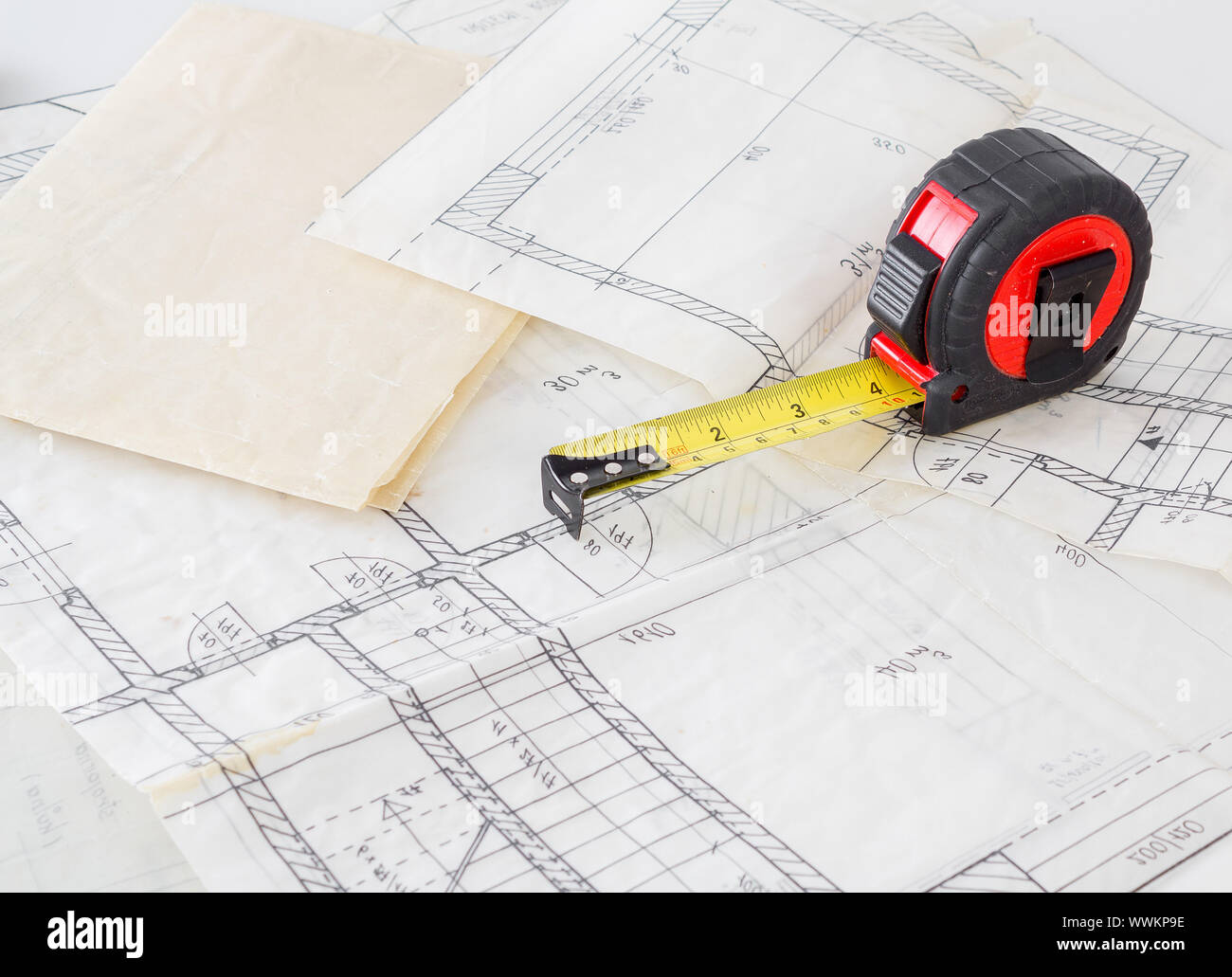 Architectural plans of the old paper and measuring tape Stock Photo - Alamy