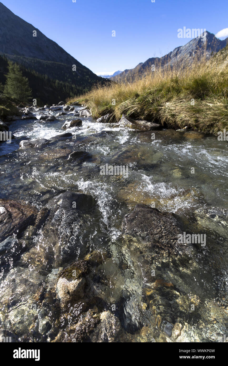 Idyllic mountain stream in the South Tyrolean mountains in autumn Stock ...
