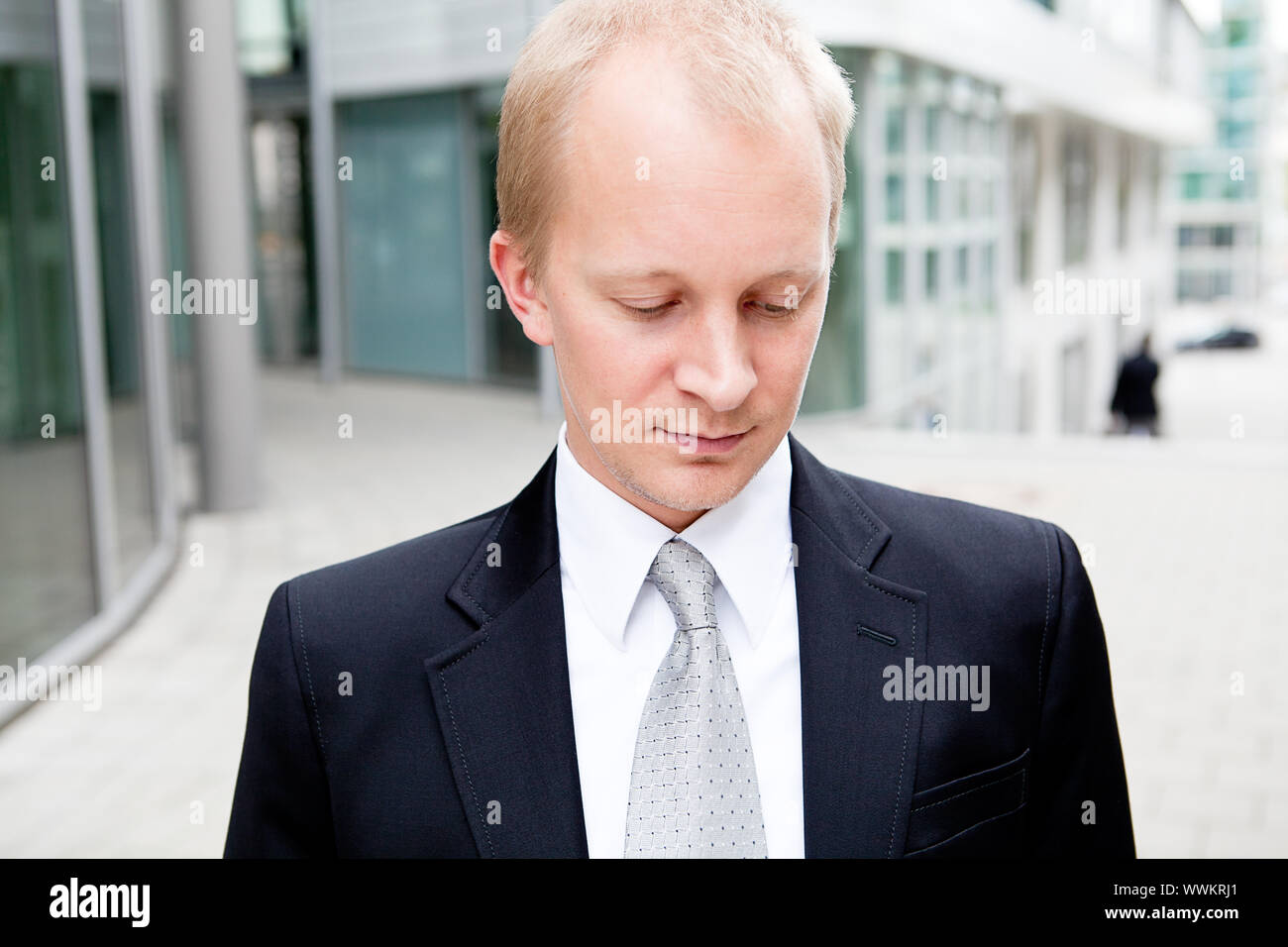 Young successful businessman with black suit Stock Photo - Alamy