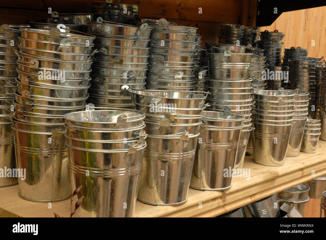many empty iron bucket in a store Stock Photo - Alamy