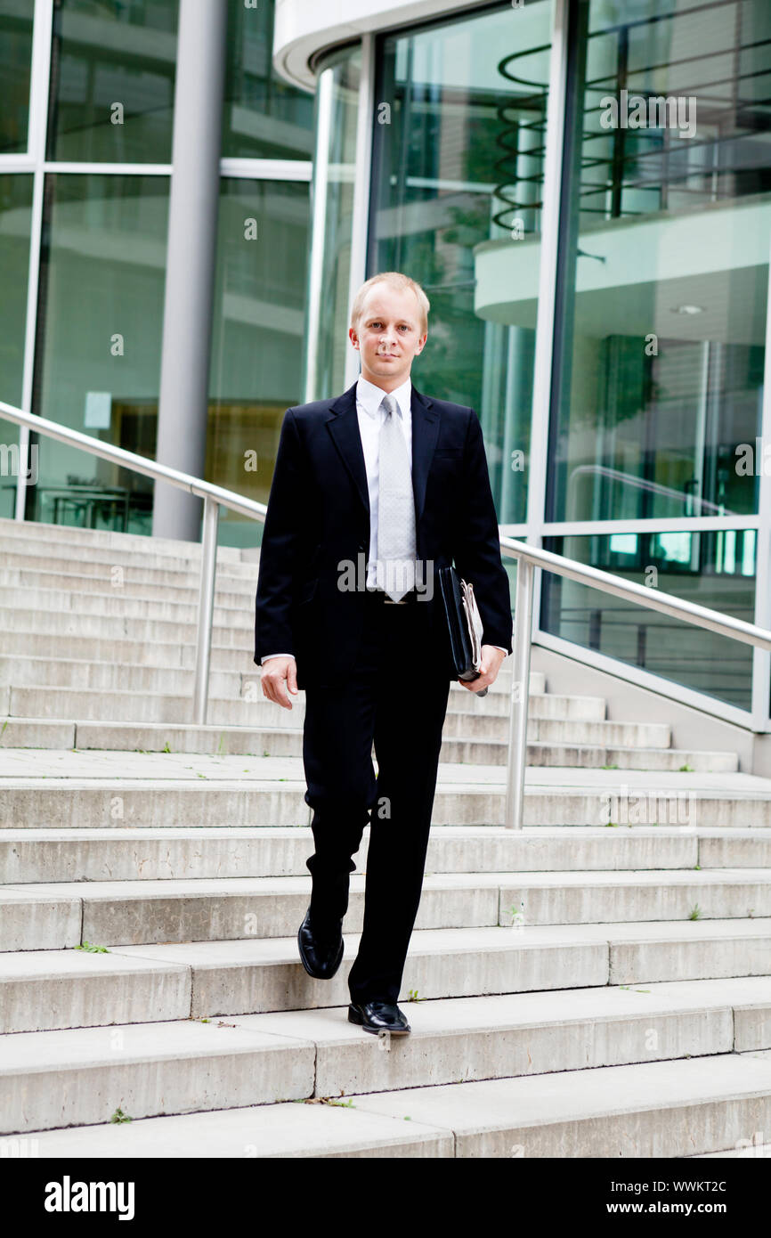 Young businessman with white shirt and black suit Stock Photo - Alamy