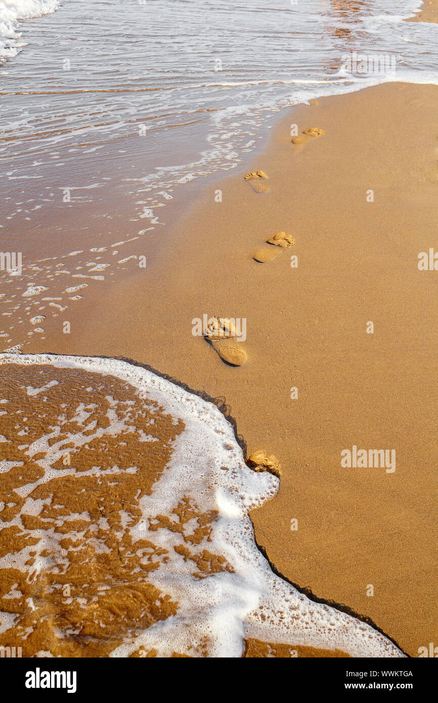 Footsteps on the beach Stock Photo - Alamy